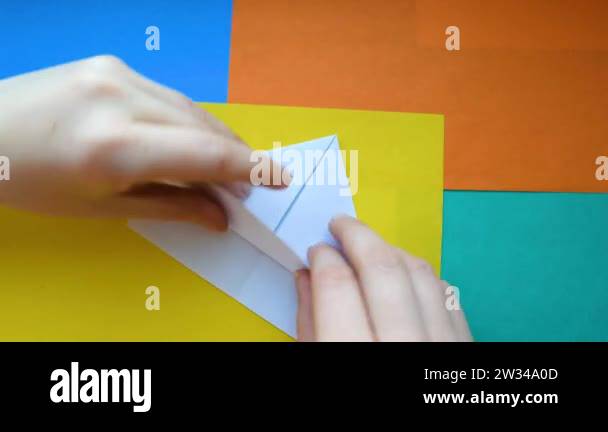 Step 4. female hands make paper boat. Step-by-step instructions on how ...