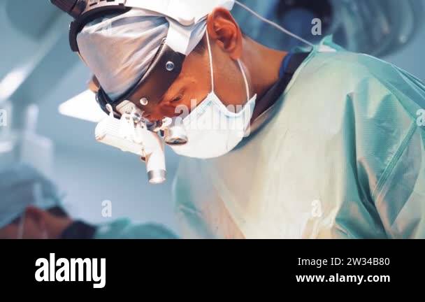 Male surgeons during the operation process. Close-up of specialists ...