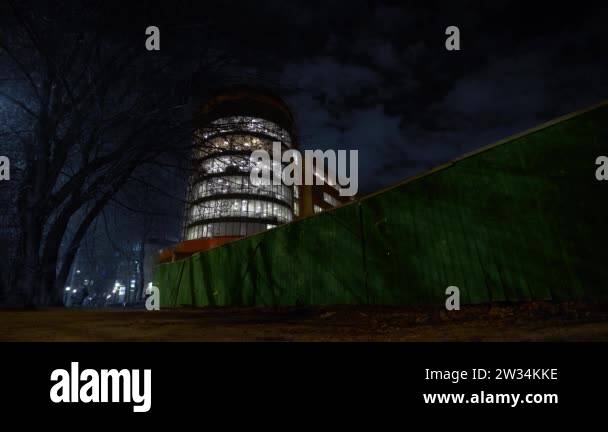 Office building at night. Exterior of an office building with lighted ...
