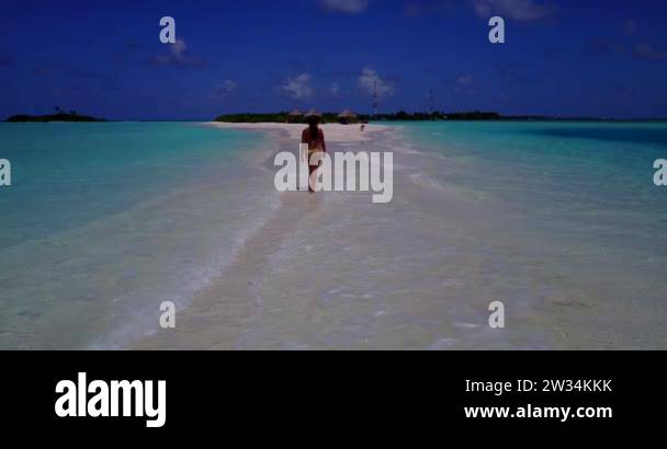 video the tan girl in bikini walking on sea scythe thinking about ...