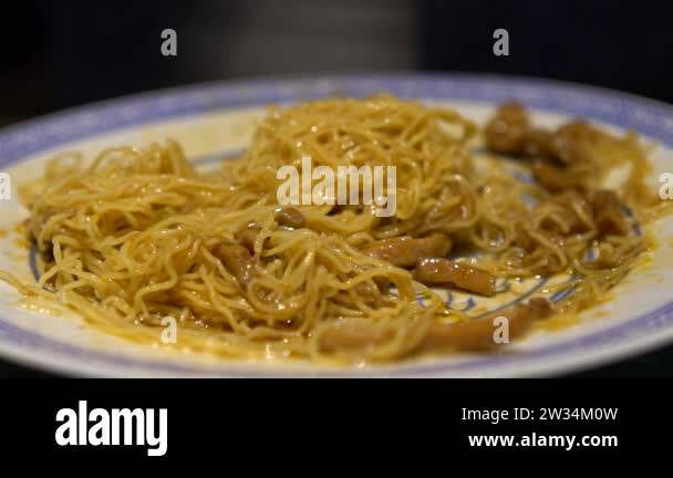 Slow motion people eating a famous noodles with meat for lunch in an ...