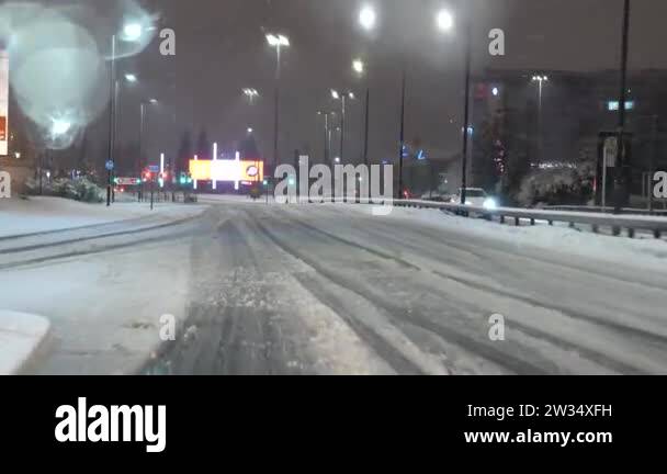 MANCHESTER, UNITED KINGDOM - CIRCA JANUARY, 2021: Driving snowy road at ...