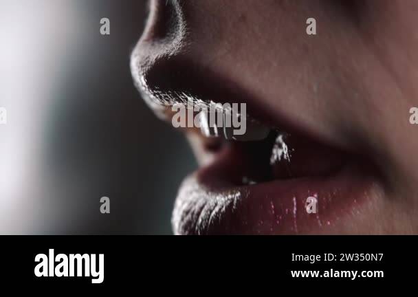 Sexy Woman Seductively Licks Lips With Tongue Macro View Of Lady