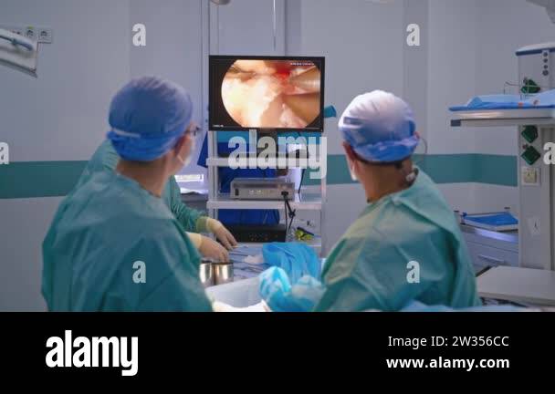 Endoscopic surgery on the monitor. Surgeons perform an operation and ...