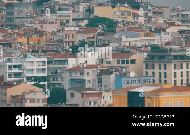 Beautiful red roofs with many satellite dishes and air conditioning ...
