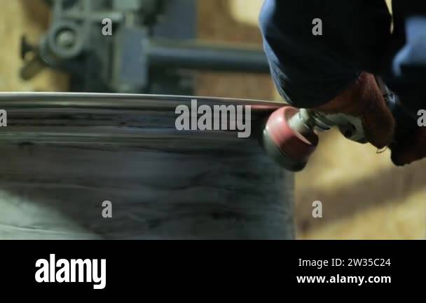 Master body repair man is working on preparing the surface of the ...