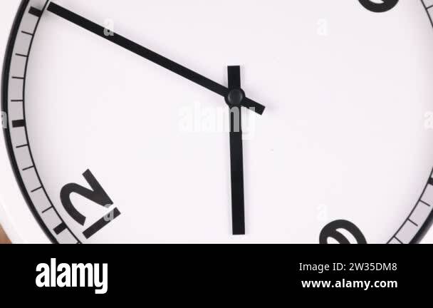 Spinning analog clock face showing the numbers 6 and 12 Stock Video ...
