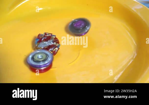 Collective image of the children's popular toy Beyblade. The battle of ...