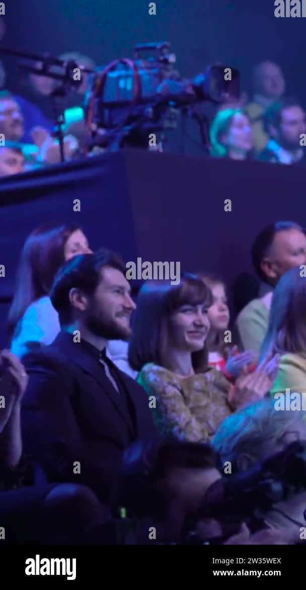 People viewers in a TV studio while recording a TV show. Vertical video ...