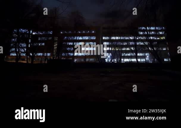 Office building at night. Exterior of an office building with lighted ...