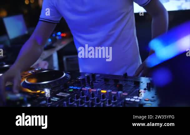 DJ hands Close up DJ sound control panel for mixing dance music with ...