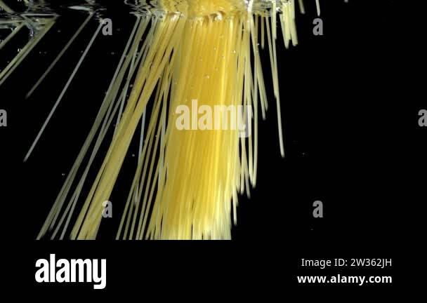 Pasta throwing in the boiling water. Spaghetti boiling. Cooking italian ...