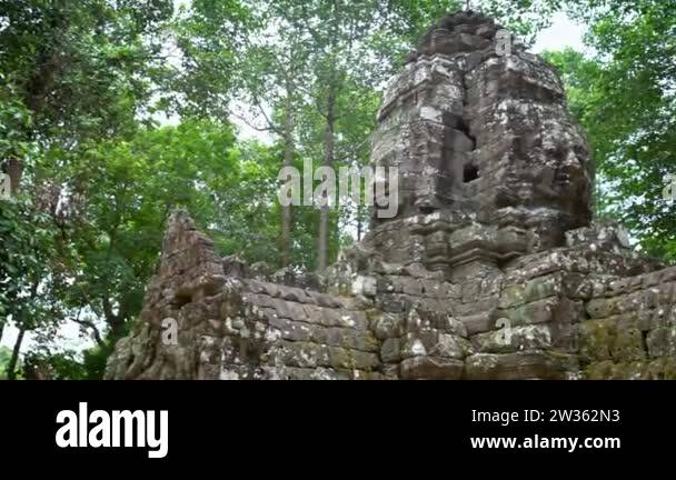 4K, Face towers of Ta Som temple. Smiling faces made of stone in Angkor ...