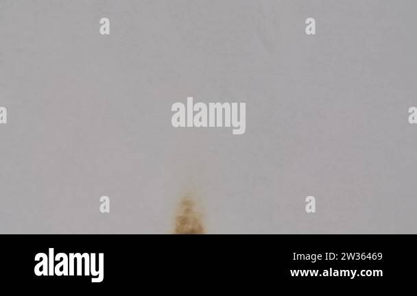 White sheet of paper burns and smokes on blue screen chroma key. Fire ...