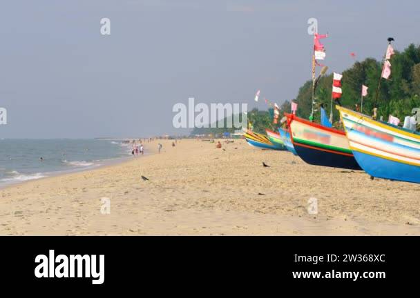 Traditional fishing boats on the famous Marari beach in Kerala, India ...