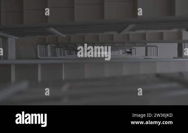 Stairs in a high rise building and a man going down. Stock. Top view of ...