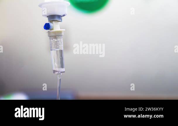 Cinemagraph of a fluid intravenous saline drip in a hospital room ...