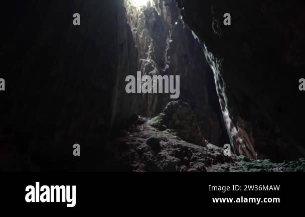 4K, The sun rays inside the beautiful natural limestone cave in ...