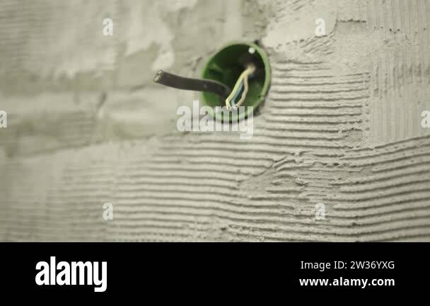 Internal socket for a socket in a concrete wall with protruding wires ...