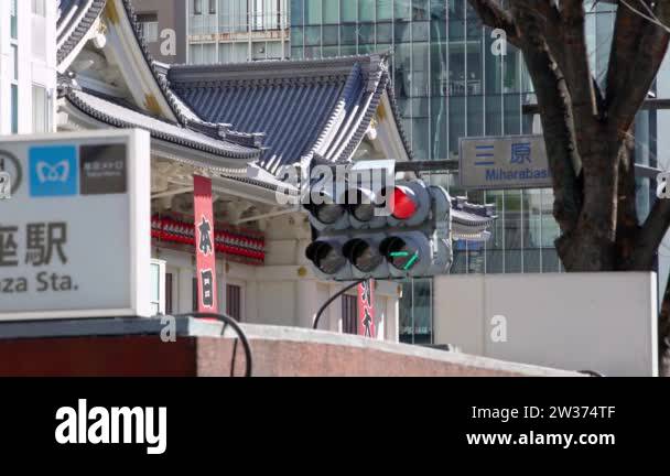 4K Asian pedestrian crosswalk sign Tokyo city. Traffic lights change ...