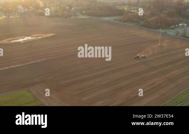 Farmer on Tractor Plowing Dusty Arid Soil. Farm Car Followed by Flock ...