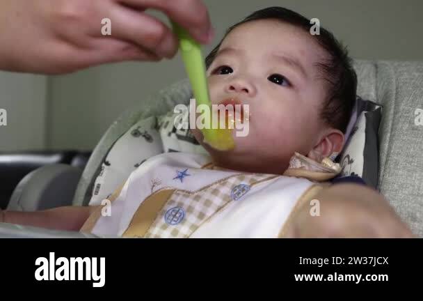 Chinese baby and eat Stock Videos & Footage - HD and 4K Video Clips - Alamy