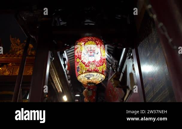 4K, Beautiful traditional Chinese lantern hangs with an aged carved and ...
