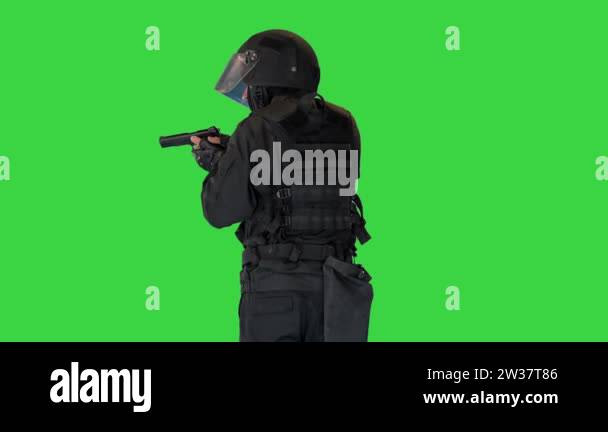 Armed Police Officer Aiming and shooting with a pistol while walking on ...