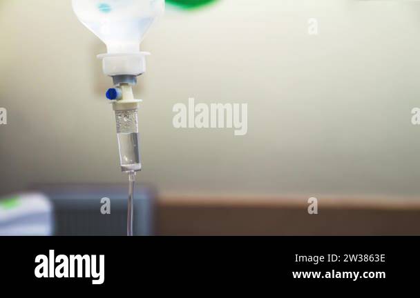 Cinemagraph of a fluid intravenous saline drip in a hospital room ...