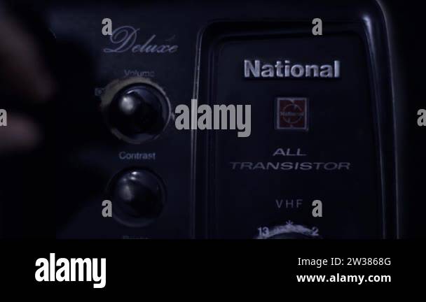 Male Hand adjusting the Volume on an Old Retro TV. Close-Up. Blue Dark ...