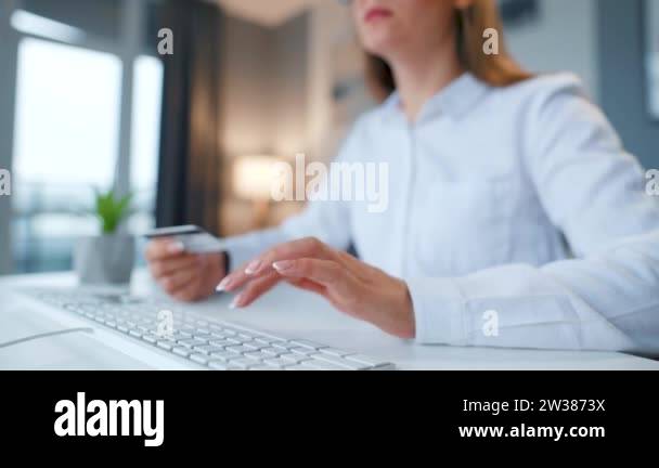 Female hands typing credit card number on computer keyboard. Woman ...