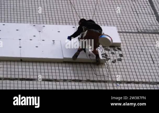 Industrial Climber Insulation of Facade Old High-Rise Building Using ...