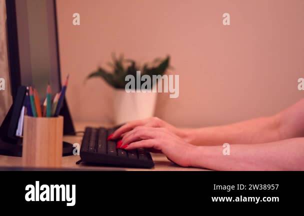 Women's hands quickly type on the keyboard. The concept of office or ...