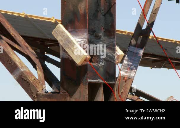 Mining of a metal structure with a red dynamite block TNT. Blasting ...