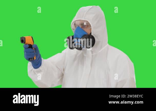 Doctor using infrared forehead thermometer gun to check body ...