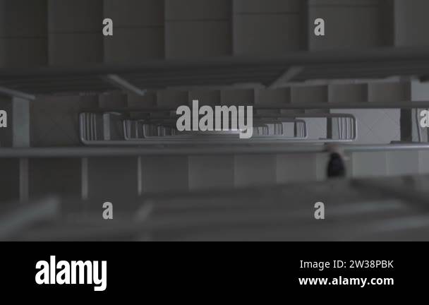 Stairs in a high rise building and a man going down. Stock. Top view of ...