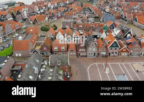 Aerial flying above the typical Dutch houses of Volendam showing the ...