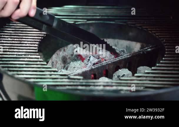 Red hot burning coal in modern portable brazier grill. Flames and red ...