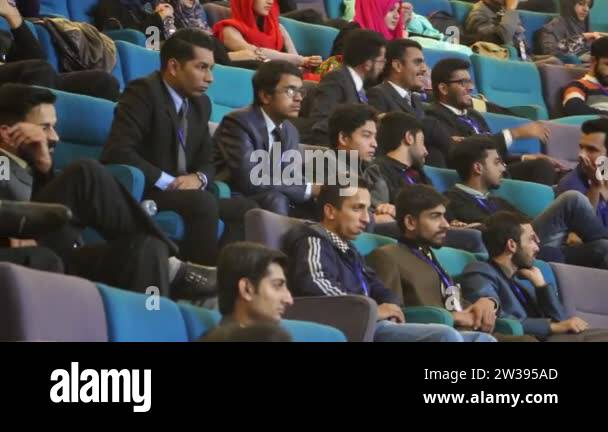 ISLAMABAD, PAKISTAN - DEC 03, 2016: Young crowd listening to ...
