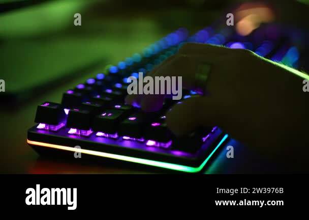 Keyboard with RGB backlit illumination changing colors while pro hacker ...