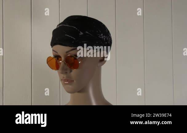 Female mannequin poses close-up for fashion video with sunglasses and ...