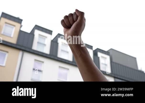 The raised fist or the clenched fist is a hand gesture symbol of ...