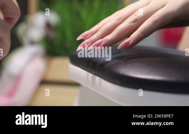 Professional manicure. Nail extension. Treatment of hands with an ...