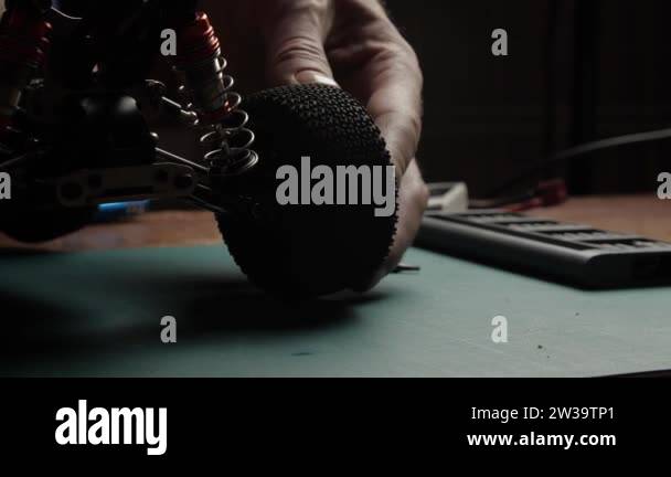 Close-up radio control model buggy car. The hands of the master ...