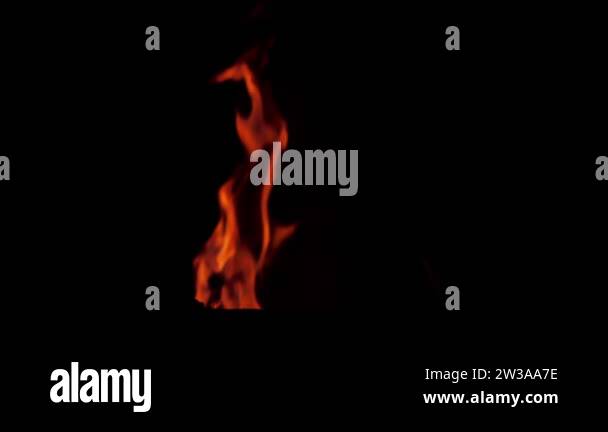 Real fire flames and sparks in slow motion isolated on black background ...