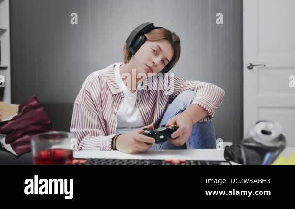 Boring Young Gamer Girl playing in Video Games on a Console Stock Video ...