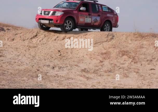 MOSCOW, RUSSIA - April 20. Driving off-road car Nissan Navara. Red 4x4 ...
