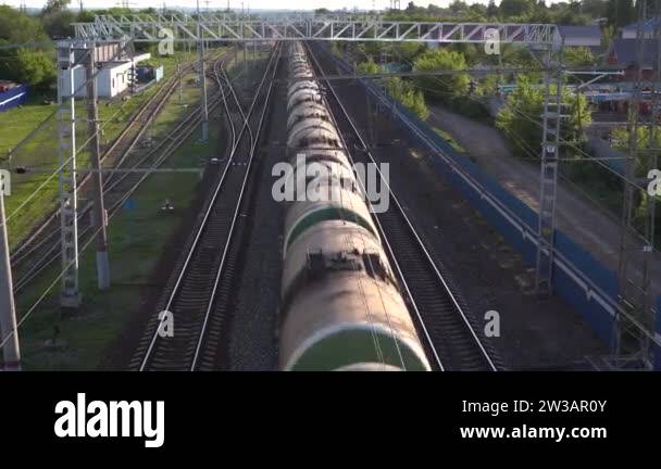 Freight train carries cargo. View of the train from above. Rail transport for intercity trade ...