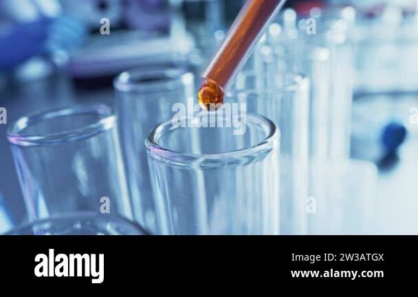 Pharmaceutics Laboratory: Pipette Dropping Red / Orange Liquid into ...