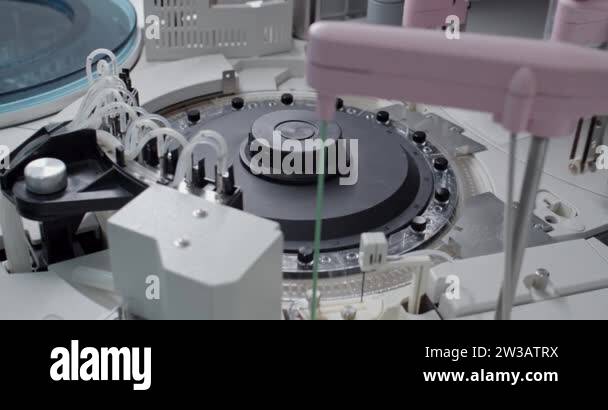 Crop view of apparatus for automatic sampling, analysis. Robo hand ...